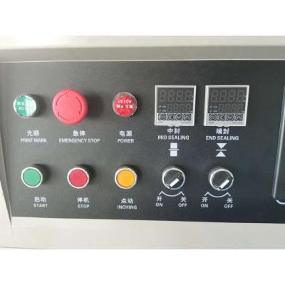 Cina La fabbrica direttamente vende la macchina avvolgitrice Toy Packing Machine del cuscino semiautomatico del pacchetto del pacchetto del sigillatore del calore in vendita
