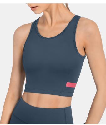 Cina Allenamento d'altezza del collo delle canottiere sportive del raccolto delle donne che esegue la canottiera sportiva del reggiseno di yoga in vendita