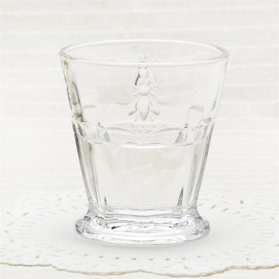China Hand pressed glass water tumbler water drinking glass 230ml embossed bee glass tumbler for sale