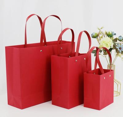 Китай Роскошные красные решетчатые ручки бумажные сумки с индивидуальным логотипом Бутикные торговые сумки для модных подарков продается