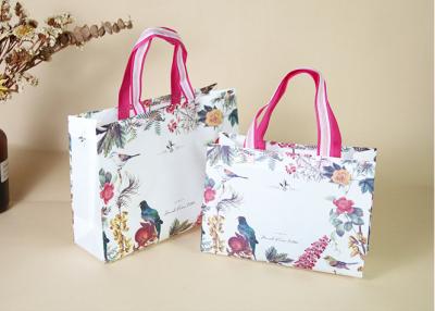 China Premium Printed Paper Shopping Bags Floral Bird Design With Pink Striped Handles for sale
