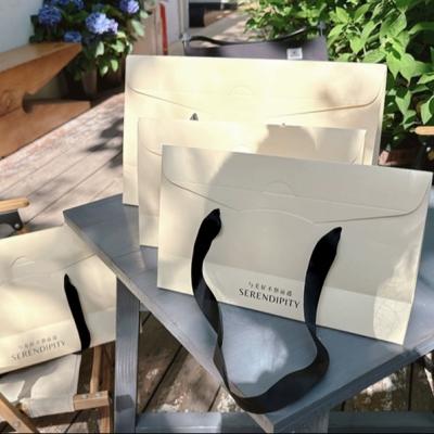China Wholesale Custom Printed Shopping Bags For Clothing Spa Jewelry Packaging for sale