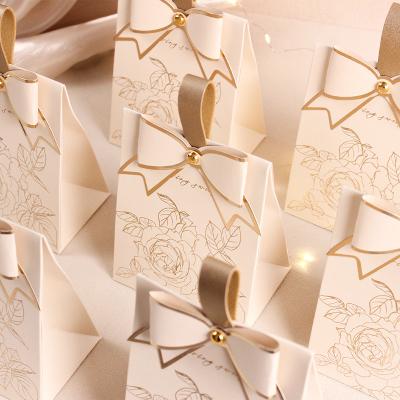 China New Rose Pattern White Folding Candy Box Retro Elegant Portable Bow Party Gift Box for sale