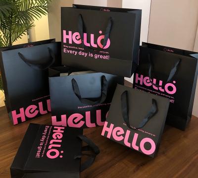 China Luxury Black Paper Shopping Bags With Handles Custom Logo Boutique Gift Bags For Clothing Stores for sale