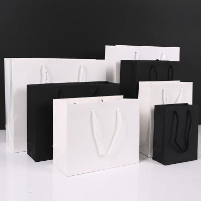 China Premium Kraft Paper Gift Bags Thickened Clothing Shopping Bags With Rope Handles for sale