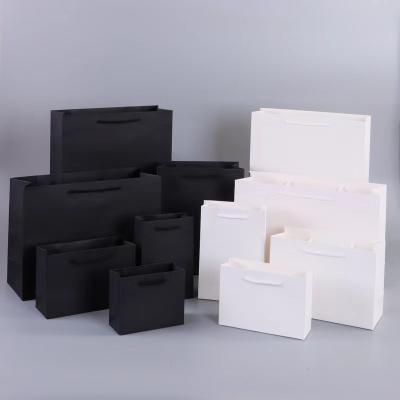 China Custom Logo Luxury Black Gift Bags Recyclable Glossy Coated for sale