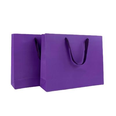 China Premium Purple Kraft Shopping Bags Heavy Duty Boutique Carry Bags Oversized Fashion Tote Custom Logo Printing for sale
