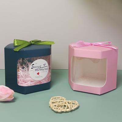 Cina Scatole regalo esagonali con fiocco di carta stampata per festival personalizzate in vendita