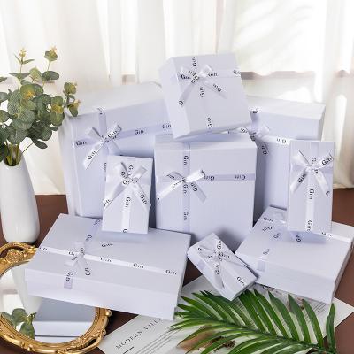 China Customized Gift Box With Ribbon And Lid For Perfume And Cosmetics Gift Packaging Box for sale