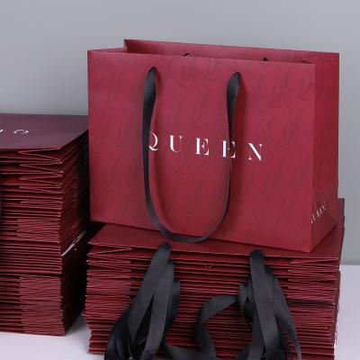 China Luxury Shopping Bag Large Waterproof Coated Tote Wine Red Fashion Boutique Packaging Custom Logo Printing for sale