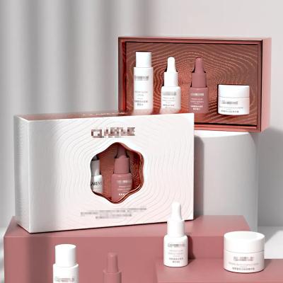 China Luxury Serum Gift Box Set Premium Cosmetic Packaging With Laser Cut Design Elegant Hollow Pattern Gold Foil Stamping for sale