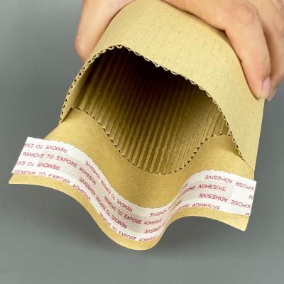 China Hot Sale Eco Friendly Brown Kraft Paper Bubble Mailer Bag Biodegradable Cardboard Bubble Paper Wrap Packaging for sale