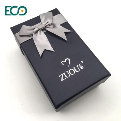 Cina Custom Black And Silver Foil Logo Lid And Base Gift Packaging Paper Rigid Box With Cream Bow Ribbon in vendita