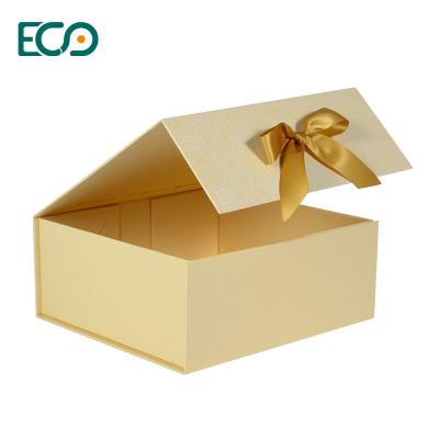 China Gold Rigids Box Magnetic Closure Gift Cardboard Box Packaging With Ribbon for sale