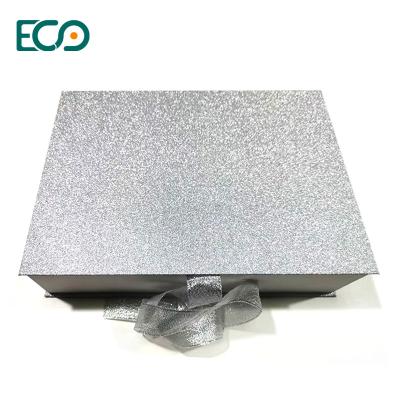 China Ready To Ship Regular Size Decorative Glittering Gold Finishing Luxury Square Gift Box With Ribbon And Magnetic Lid for sale