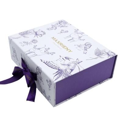China Luxury Purple Cosmetic Folding Corrugated Box Collapsible Magnetic Rigid Box With Ribbon for sale