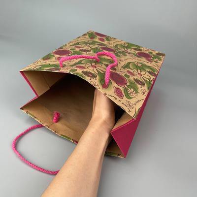 China Gift Perfume Kraft Paper Packaing Bag Floral With Pink Red Rope Handle for sale