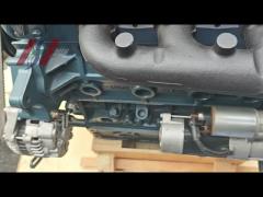 Kubota V3300-DI-ES02, a four-cylinder, vertical, water-cooled diesel engine.