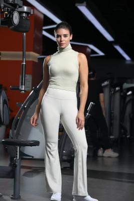 China Ladies Turtleneck Crop Top Compression Fit Built In Bra Elastic Bottom Band for sale