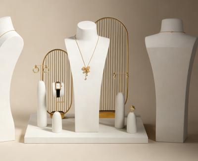 China Elegant Modern High Quality Jewelry Display Set with LED Lighting White Velvet & Gold Metal Stand for Jewelry Retail for sale