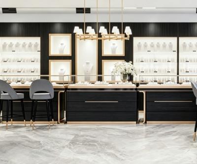 China Custom Luxury Jewelry Shop Solution, Sleek Black & Gold Showcase with Integrated LED Lighting & Chandelier for sale