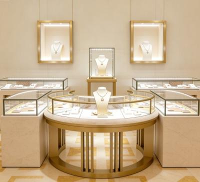 China Luxury Curved Jewelry Display Cabinet LED Lighting | Cream Color Gold Metal Frame | Custom High-End Showcase for Jewelry Malls for sale