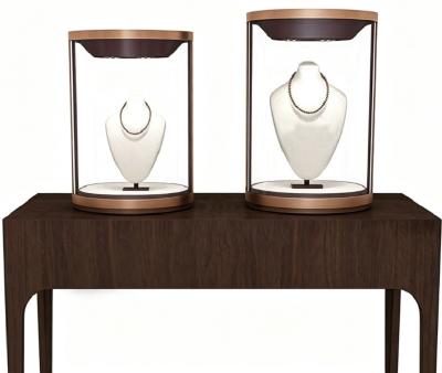 China Luxury Rose Gold Finish Jewelry Display Cabinet with Integrated LED Lighting and Adjustable Glass Shelves for sale