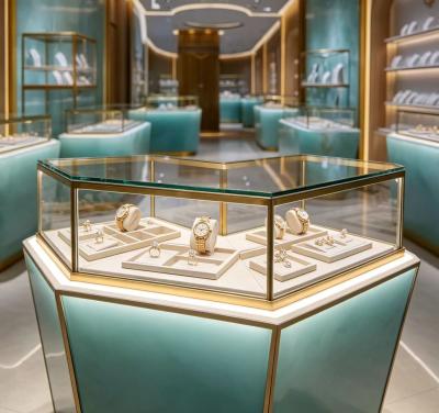 China Exclusive Jewelry Retail Space with Textured Wallpaper and LED Spotlights in White and Gold Color Scheme for sale