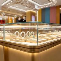 China Upright Display Case with Adjustable Glass Shelves, Ventilated Back Panel, and Lockable Design for Secure Storage for sale