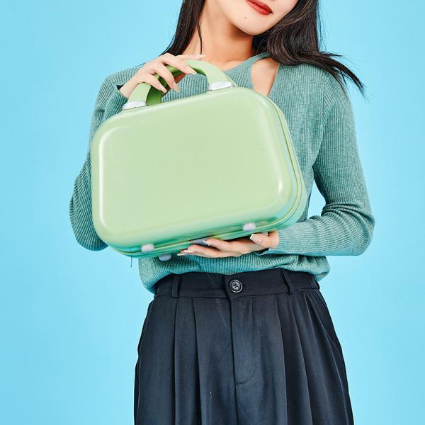 Quality 777 candy colored suitcase with swivel wheels, lightweight pink boarding case, for sale