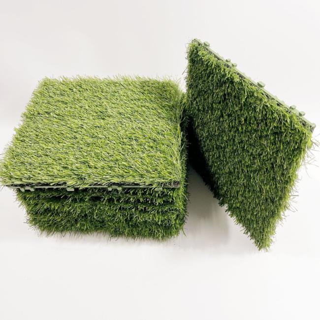 Interlocking mechanism of grass carpet tiles