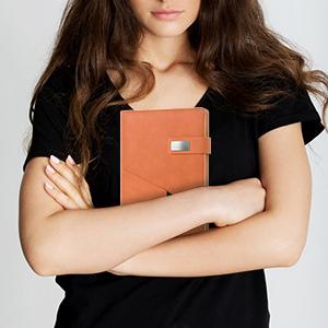 black notebook with pen