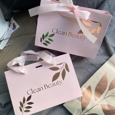 China Competitive Price Elegant Customized Brand Logo Luxury Wine Boutique Shopping PinkPaper Gift Bags With Ribbon Handles for sale