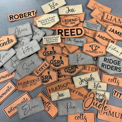 China Best Supplier China Manufacturer Hot Sale Debossed Leather Logo Name Label Iron On Sew On Custom Leather Patch For Caps Hats Jeans for sale