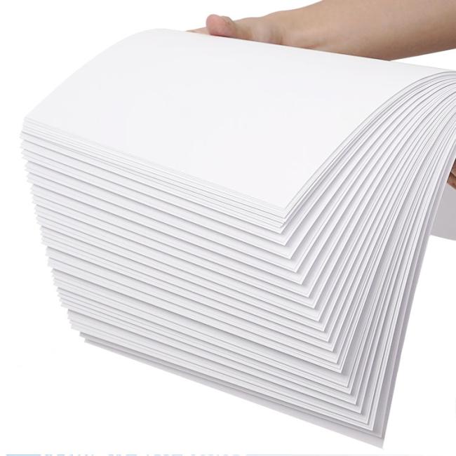 Stack of white art paper sheets showing uniform thickness