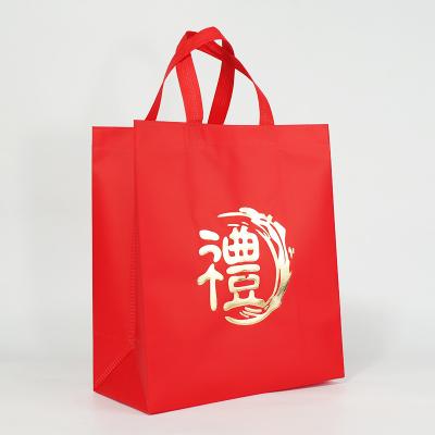 Cina Sacchetto della spesa non tessuto riutilizzabile della maniglia del nuovo anno della borsa cinese del regalo con il logos in vendita