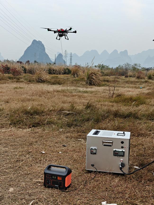UAV in flight with tethered power system