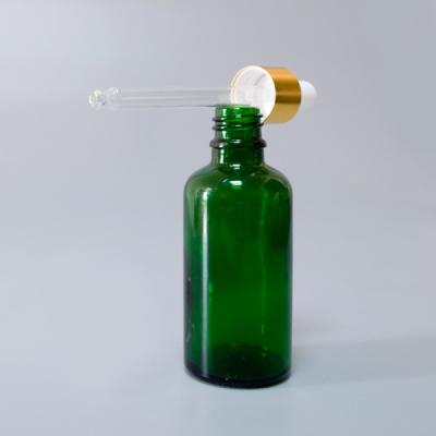 China 100ml clear green color glass essential oil bottle with insert and tamper proof cap for essential oil for sale