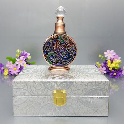 China Beautiful New design 12mL crystal and metal top gear essential oil bottle from Hebei Shengxiang for sale