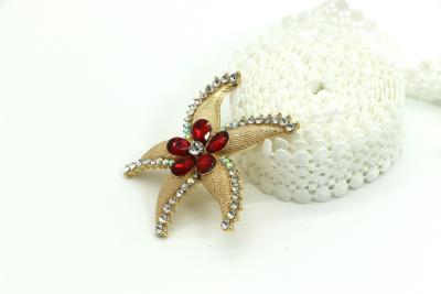 Cina Cinque perni aguzzi della fibula della stella per il ODM dell'OEM del diamante intarsiato oro dei vestiti in vendita