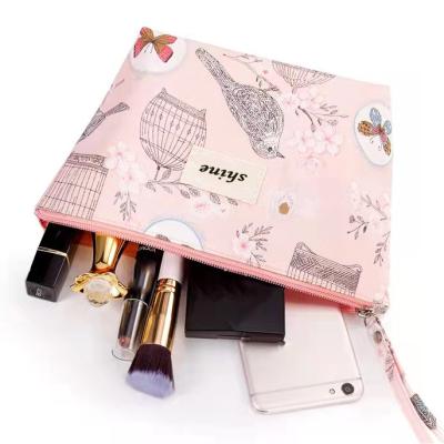 Cina ODM dell'OEM molle stampato rosa del materiale del tessuto della tela del modello animale cosmetico della borsa della chiusura lampo in vendita