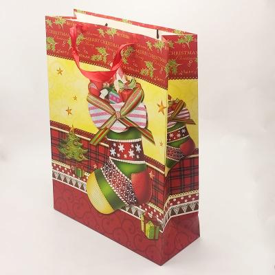 China Luxury Custom Printed Shopping Gift Paper Bag With Logo Airtight Waterproof for sale
