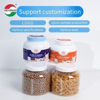 Cina Barattolo cilindrico in plastica trasparente per alimenti da 100 g, barattolo in plastica da 1100 ml per contenitori per la conservazione di noci, biscotti e caramelle in vendita