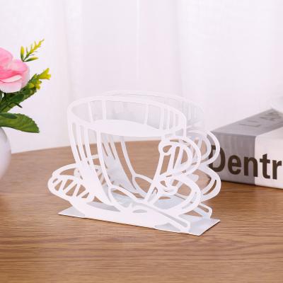 Cina Stoccaggio decorativo moderno del supporto del tovagliolo del metallo di forma della tazza di caffè inossidabile in vendita