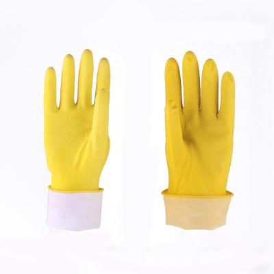 China Yellow color household gloves dip/spray flocklined rubber gloves for sale
