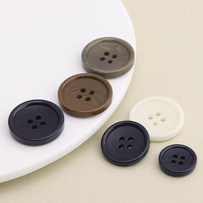 China Eco Friendly Black Corozo Buttons Hot Pressing Carving Technique Customizable Sizes for sale