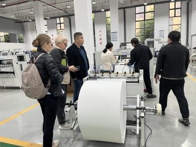 China High Efficient Automatic Foam hot melt adhesive Intermittent Gluing and Wave Receiving Production Line for sale