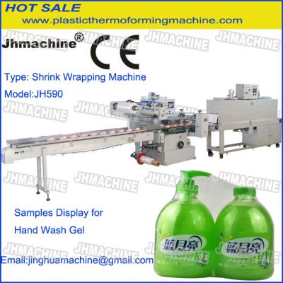 China Las botellas/el gel poner crema del lavado a mano embotella la empaquetadora automática del envoltorio retractor /Flow en venta