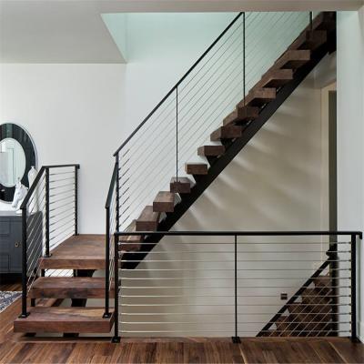 China Metal staircase design with closed riser and posted glass railing for sale