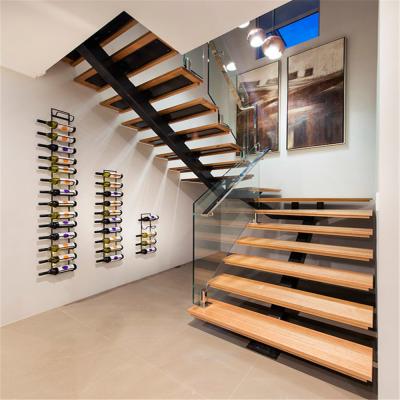 China residential steel stairs with wooden steps glass rail design for sale